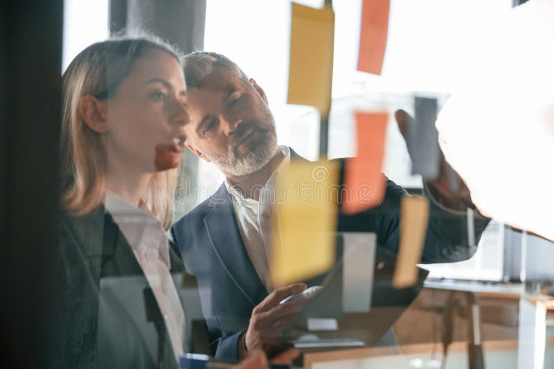 Creating the Plan. Putting Stickers on the Glass Stock Image - Image of ...