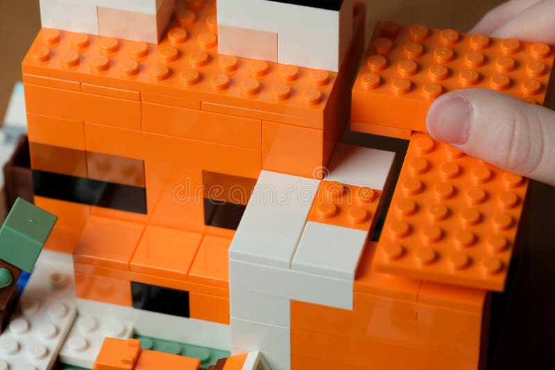 Creating a Vibrant Orange Creature with Interlocking Bricks Stock Image ...