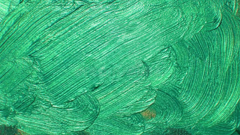Creating Vibrant Textured Art with Green Paint Using a Brush in a ...