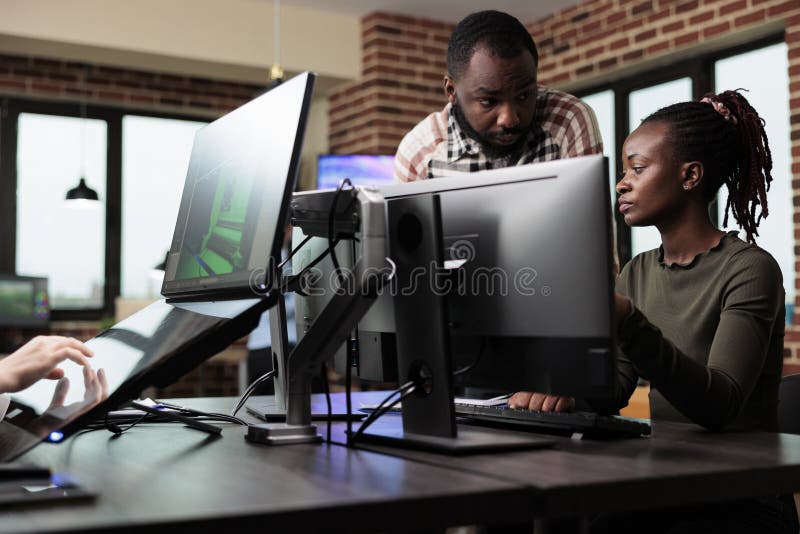 Creative African American Office Workers Discussing about 3D Project ...