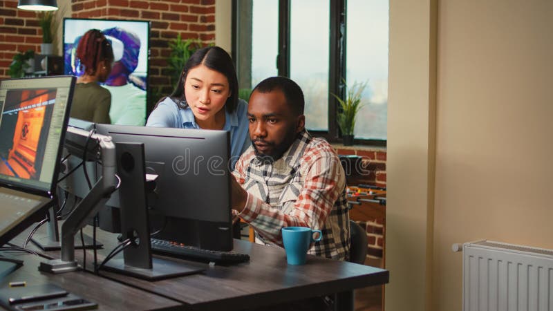 Creative Agency Employees Using Computers To Develop New Graphics ...