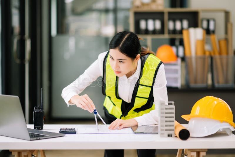 Creative Architect Projecting on the Big Drawings Working and Laptop ...
