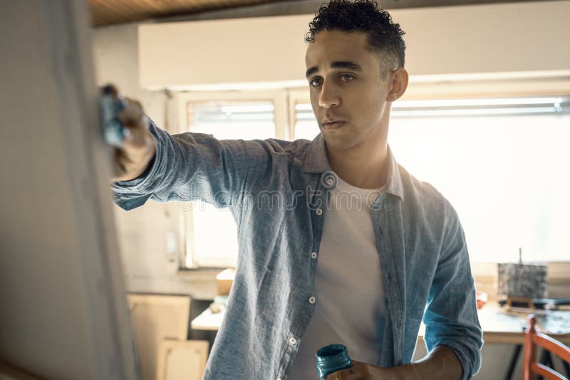 Artist Working in the Studio and Looking at the Painting Stock Image ...