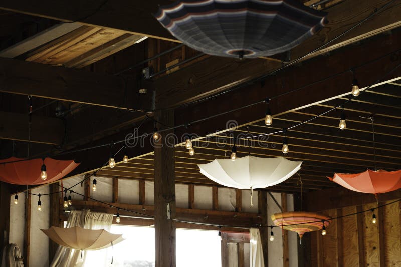 Artistic Ceiling Decor with Umbrellas and String Lights Stock Image ...