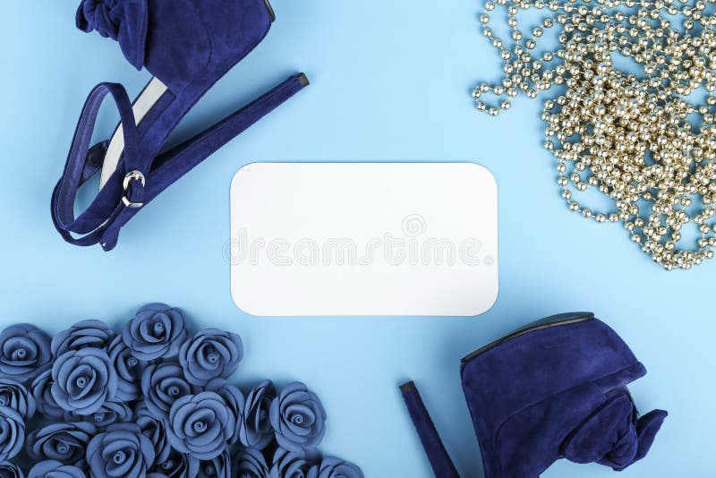 Creative Backdrop with High Heels Shoes and Accessories on Blue ...