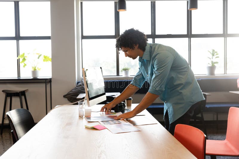 Creative Biracial Young Businessman Working at Computer Desk in Office ...