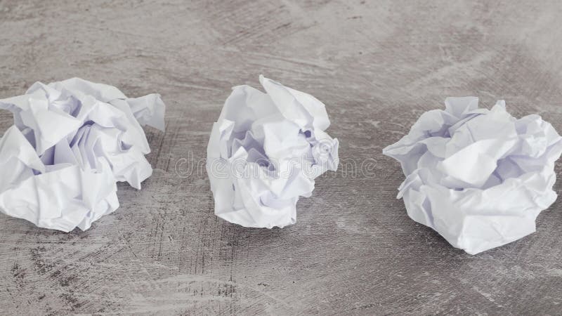 Creative Block Concept, Scrunched Paper Sheets and Lightbulb at the End ...