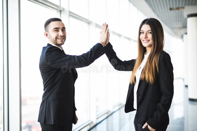 Creative Business Couple Hands Up Doing High Five in Office Stock Photo ...