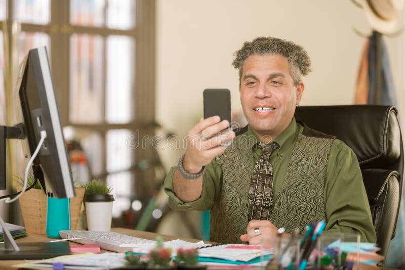 Creative Business Man in an Office Using Mobile Device Stock Image ...