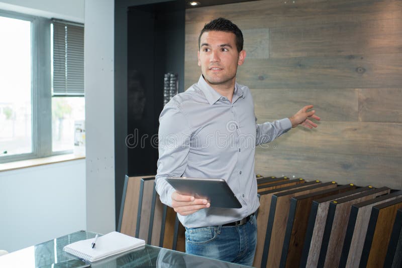 Creative Business Man Pointing Out at Wall in Office Stock Image ...