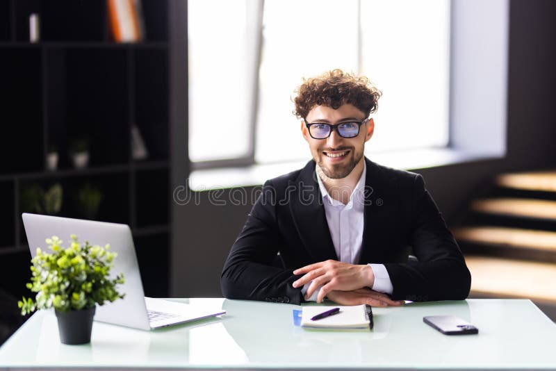 Creative Business Man Working on a Laptop in an Open Plan Office Stock ...