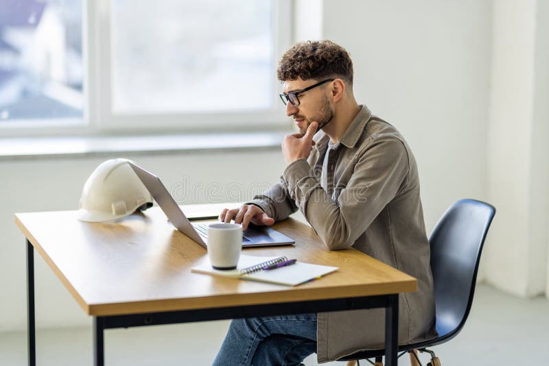 Creative Business Man Working on a Laptop in an Open Plan Office Stock ...