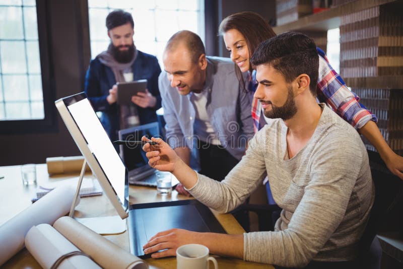 Creative Business People Discussing Over Computer Stock Image - Image ...