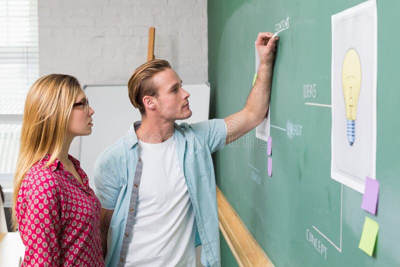 Creative Business People at Work by Blackboard Stock Image - Image of ...