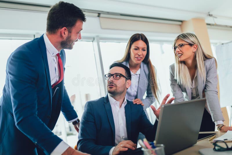 Business People Working on Business Project in Office Using Laptop ...