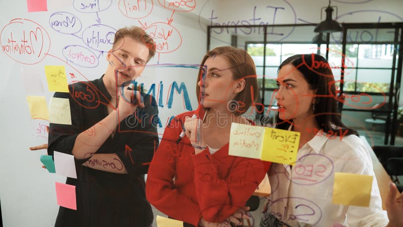 Creative Business Team Sharing Idea, Writing Down on Sticky Note ...