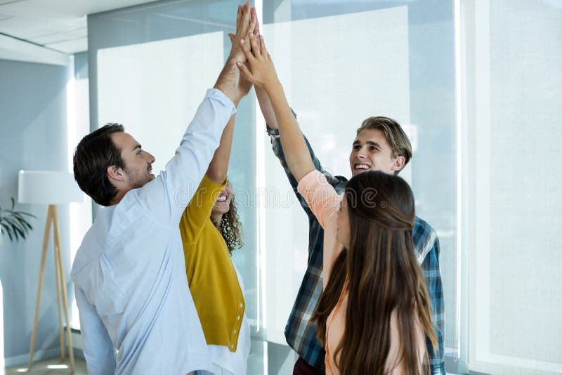 Creative Business Team Giving a High Five To Each Other Stock Image ...