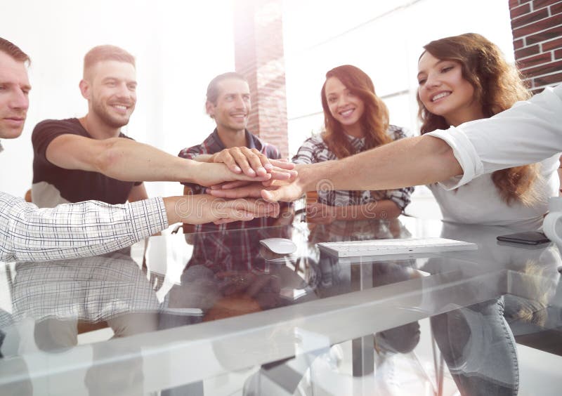 Creative Business Team Putting Hands Together at the Office Stock Photo ...