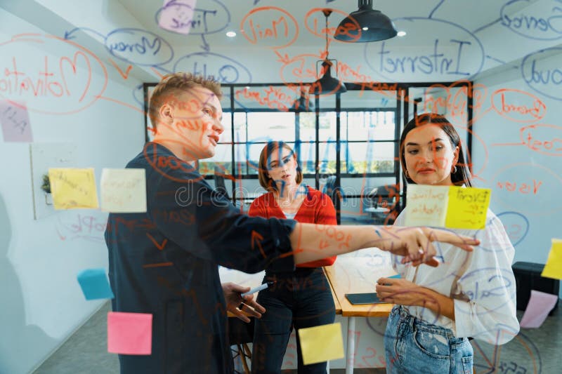 Creative Business Team Sharing Idea, Writing Down on Sticky Note ...