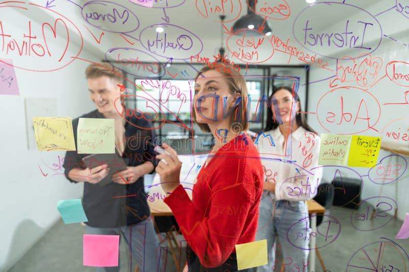 Creative Business Team Sharing Idea, Writing Down on Sticky Note ...