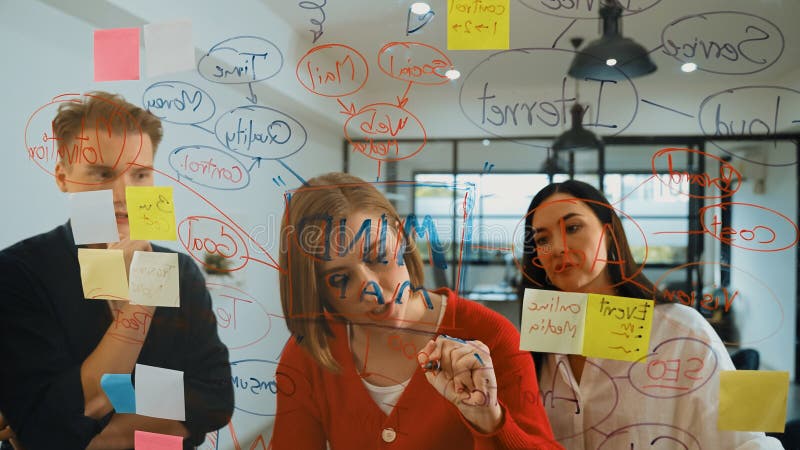 Creative Business Team Sharing Idea, Writing Down on Sticky Note ...