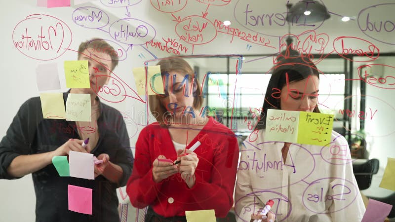 Creative Business Team Sharing Idea, Writing Down on Sticky Note ...
