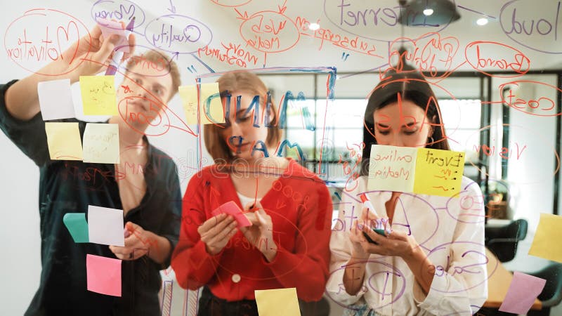 Creative Business Team Sharing Idea, Writing Down on Sticky Note ...