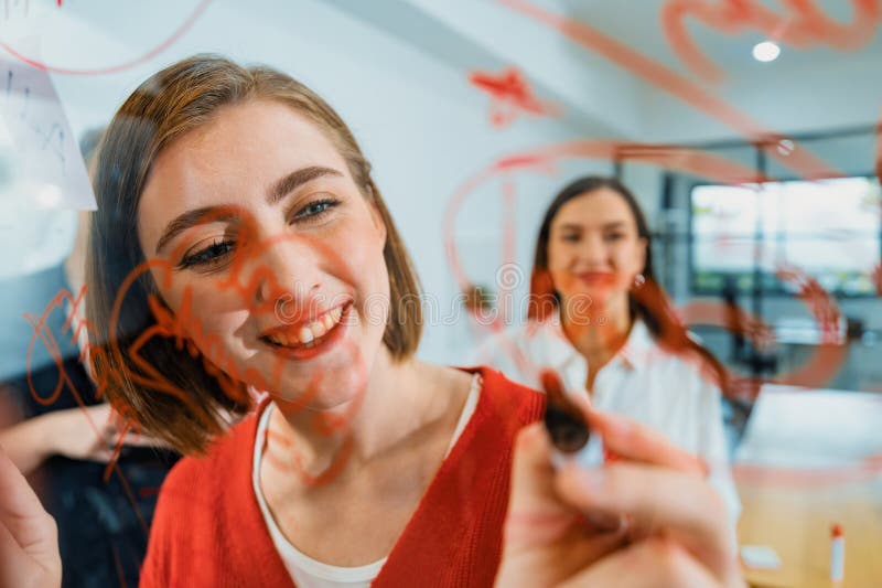 Creative Business Team Sharing Idea, Writing Down on Sticky Note ...