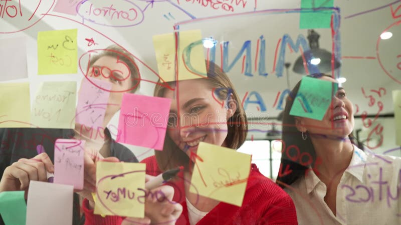 Creative Business Team Sharing Idea, Writing Down on Sticky Note ...