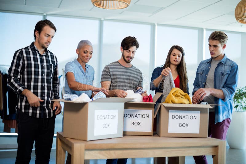 Creative Business Team Sorting Clothes in Donation Box Stock Image ...