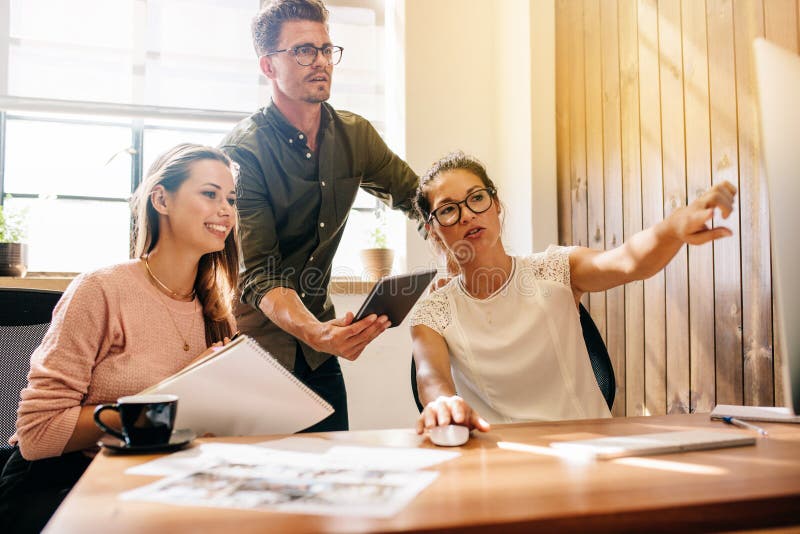 Creative Business Team Working Together on Computer Stock Image - Image ...