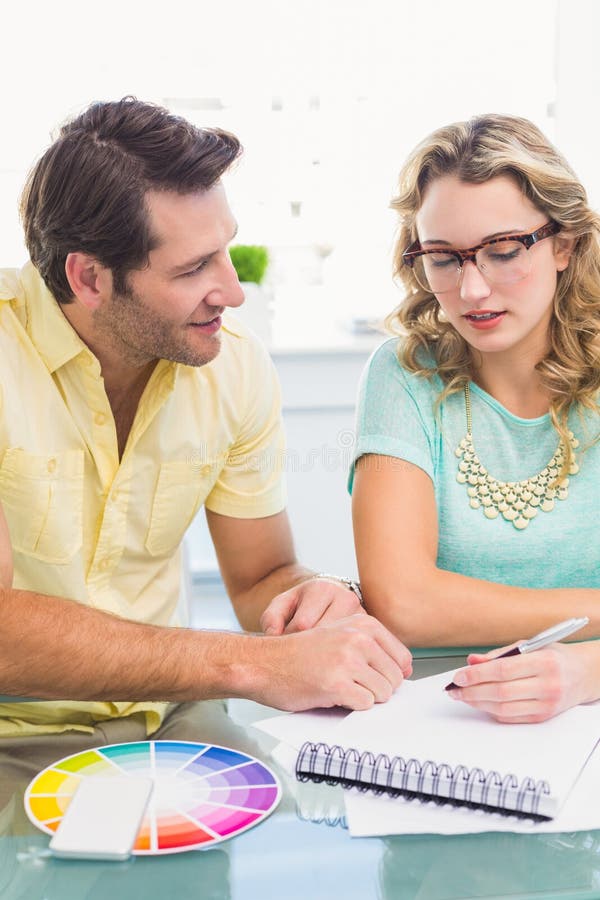 Creative Business Team Working Together at Desk Stock Photo - Image of ...