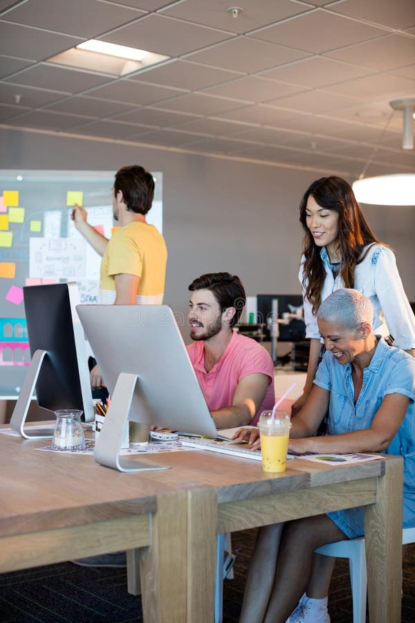 Creative Business Team Working Together on Desktop Pc Stock Photo ...