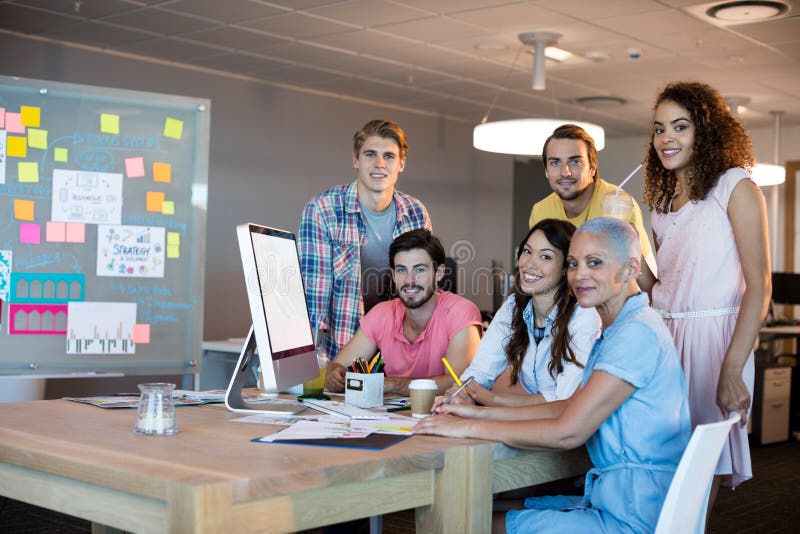 Creative Business Team Working Together on Desktop Pc in Office Stock ...