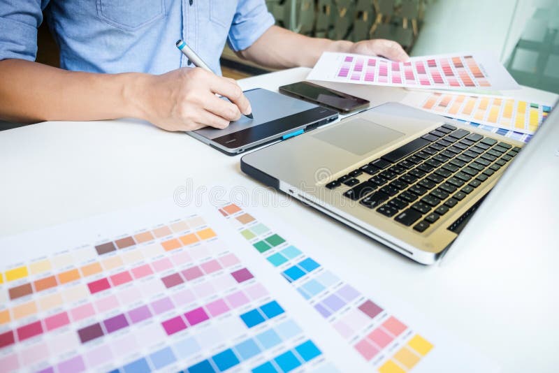 Creative Businessman or Designer Writing on Graphic Tablet while Stock ...