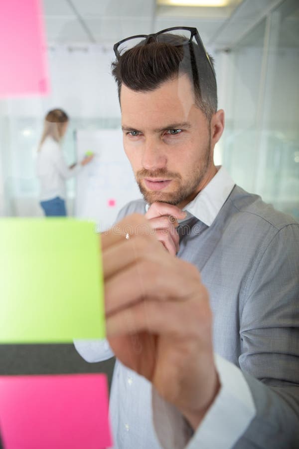 Creative Businessman Writing Notes on Paper in Office Stock Image ...