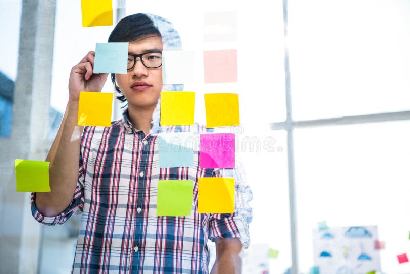 Creative Businessman Writing on Sticky Notes Stock Photo - Image of ...