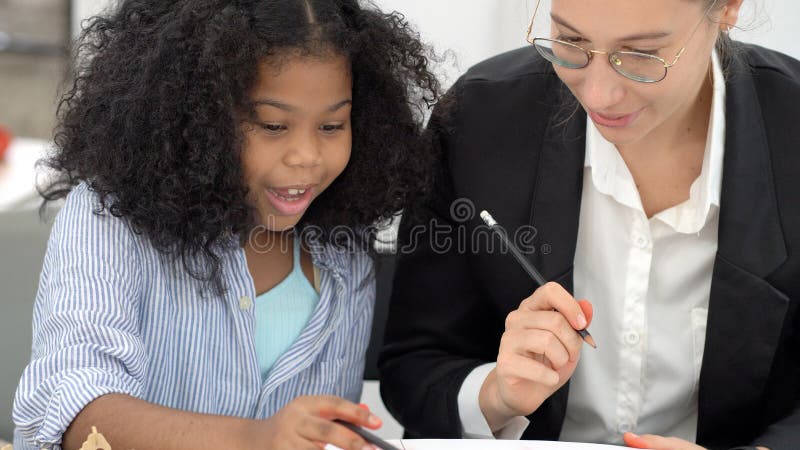 Creative Class in Diversity School Caucasian Teacher with African Kid ...