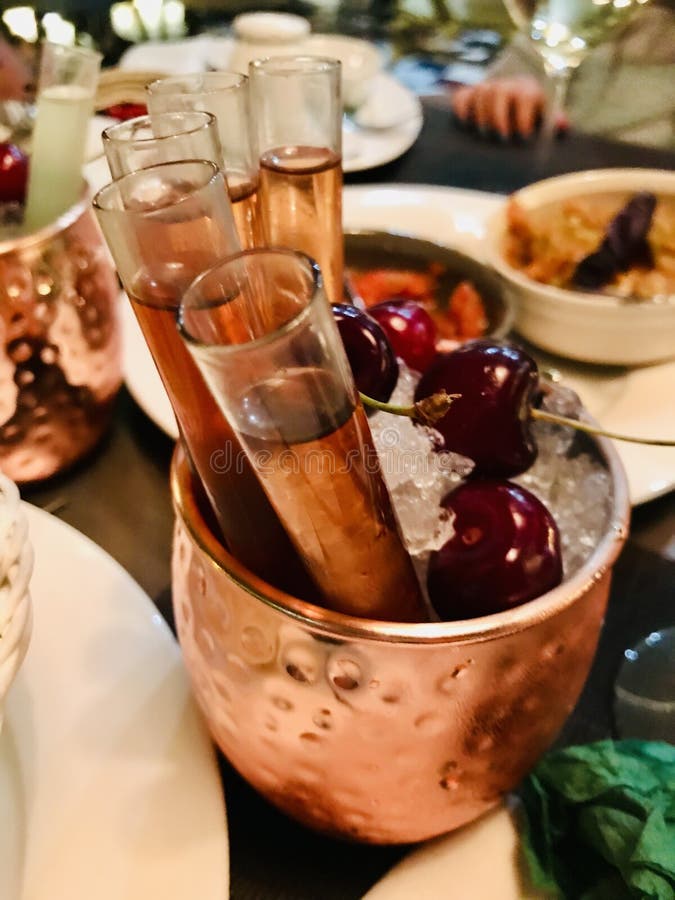 Creative Cocktail Presentation in Test Tubes with Fresh Cherries Stock ...
