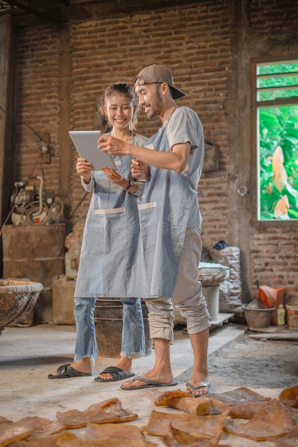 Creative Collaboration in Artisan Workshop: Engaged Artists Using Tablet Stock Image - Image of ...