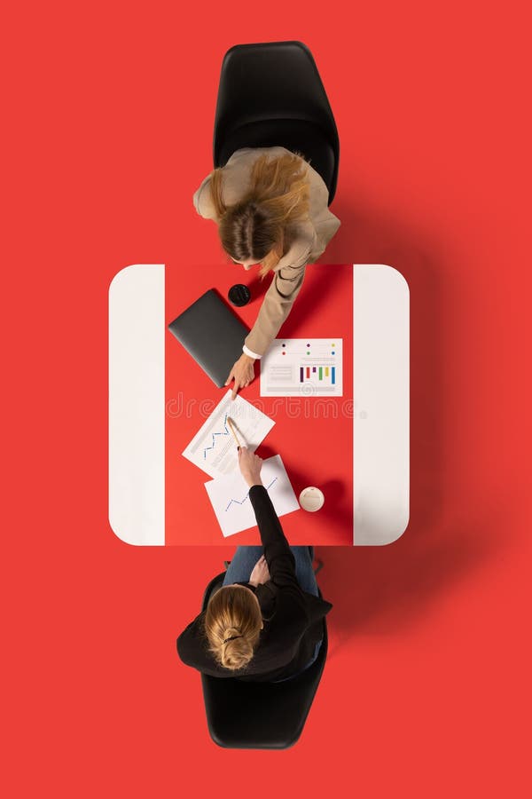 Creative Collage. Two Young Business Ladies Sitting at Common Table ...