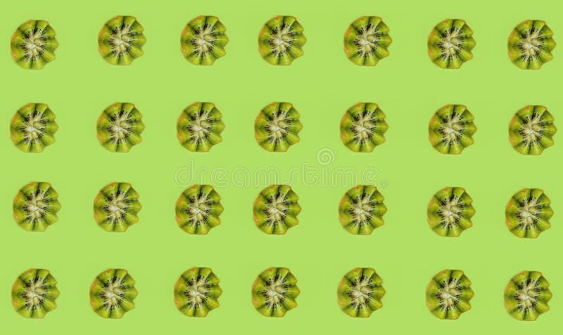 Creative Color Pattern of Green Kiwi Fruit on a Green Background ...