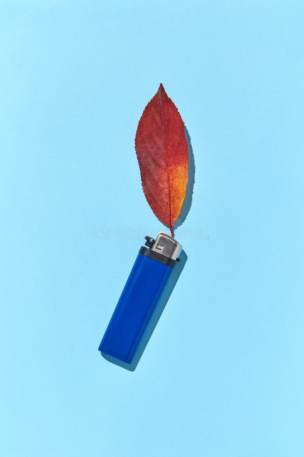 Creative Composition Blue Lighter with Fire from Fall Red Leaf and Hard ...