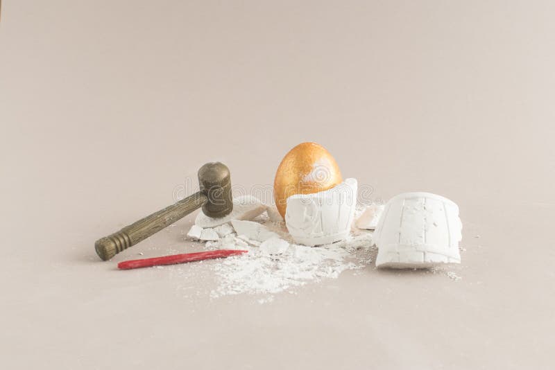 Creative Composition with Easter Golden Egg, Hammer, Nail and Old ...