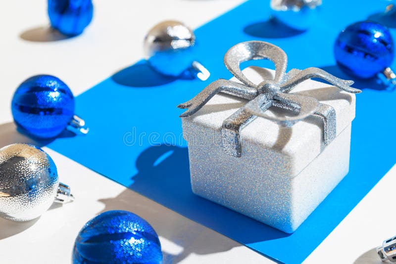 Creative Composition Made of Silver Present Box and Baubles on White ...