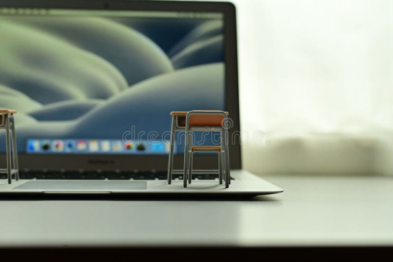 Creative Composition of Miniature School Desks Placed on a Laptop ...