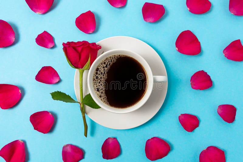 Creative Composition of Red Rose Flower and Cup of Coffee on Blue ...