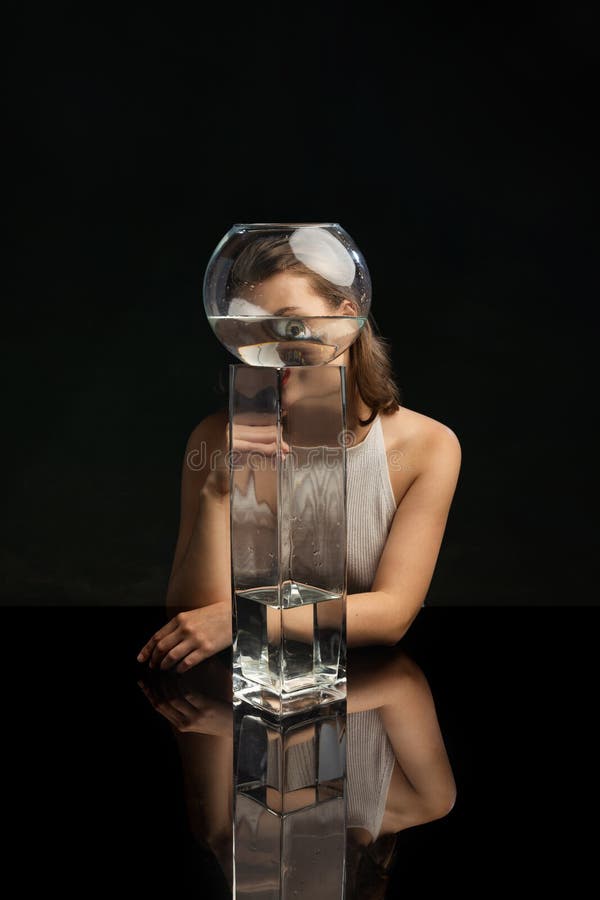 Creative Composition with Young Girl Sitting Behind Glass Vases and ...