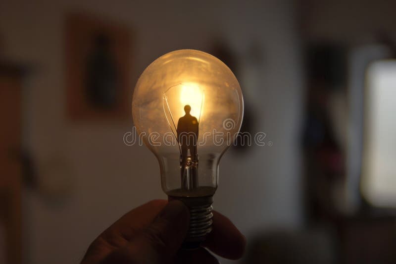 Creative Concept Photo of a Light Bulb with a Man S Silhouette Glowing ...