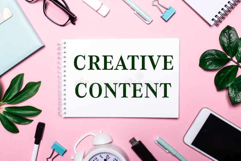 CREATIVE CONTENT is Written in a White Notebook on a Pink Background ...